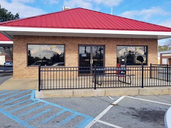That red roof and brick facade whisper promises of comfort food done right.