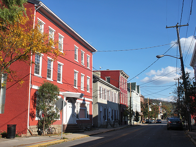Main Street magic unfolds where red brick buildings whisper stories of simpler times and smaller budgets.
