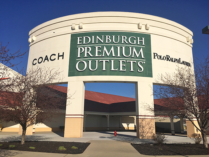 The grand entrance to Edinburgh Premium Outlets stands like a shopping cathedral. Coach and Polo Ralph Lauren beckon bargain hunters to retail paradise!