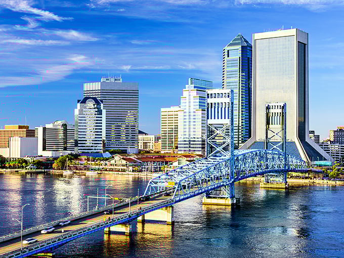 Jacksonville's skyline gleams like a hidden treasure, with that iconic blue bridge connecting worlds of possibility.