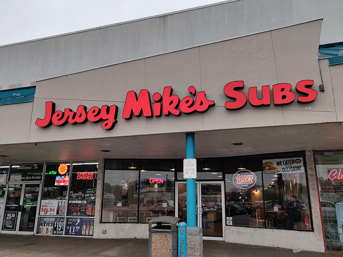 Jersey Mike's bright red sign beckons like a lighthouse for sandwich lovers. Simple storefront, extraordinary subs waiting inside.