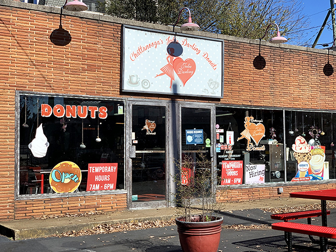 Julie Darling's brick storefront beckons with that classic neon DONUTS sign &ndash; like a lighthouse for your sweet tooth!