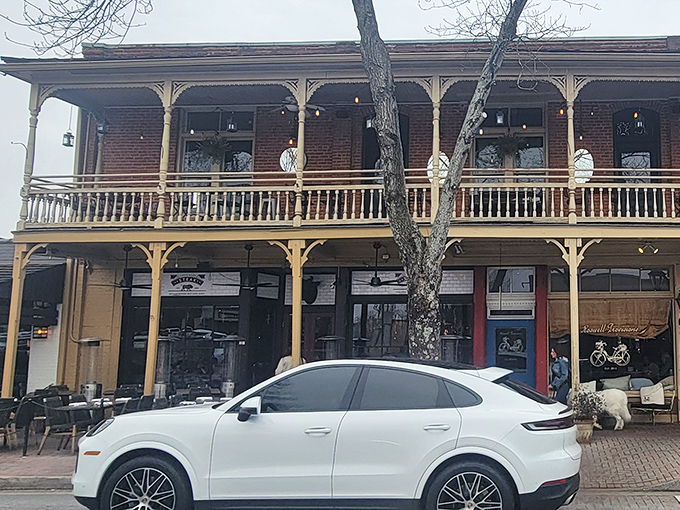 Little Alley Steak's historic brick facade in Roswell whispers tales of fine dining while that balcony begs for a sunset cocktail.