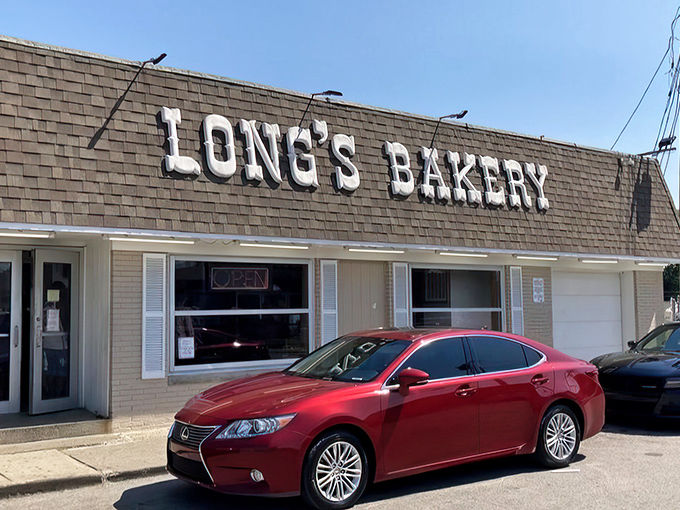 That modest roof hides a donut empire! Long's Bakery's unassuming exterior is like Clark Kent before the phone booth transformation.