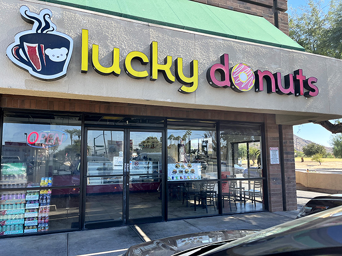 That cheerful yellow and green signage promises sweet adventures ahead at Lucky Donuts & Boba. 