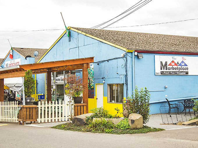 The colorful facade of M&M Marketplace beckons like a treasure chest waiting to be opened. That rainbow fence isn't just decoration&mdash;it's a promise of the vibrant finds inside!