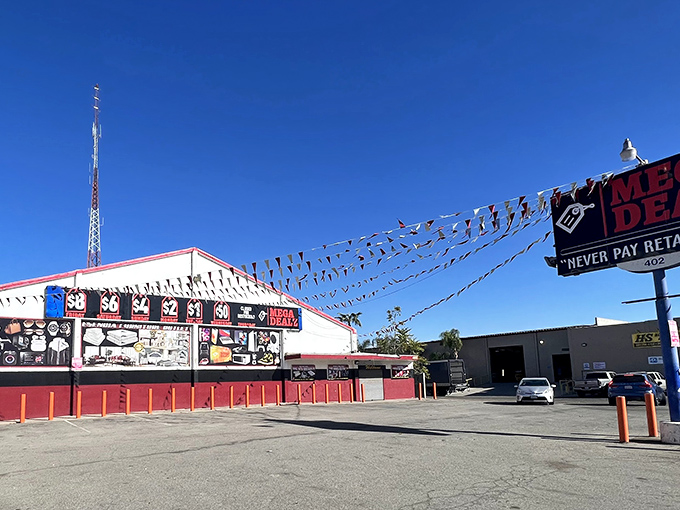 Mega Dealz beckons with colorful pennant flags and bold price signs. Bargain hunters, your mothership is calling!