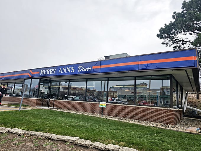 That classic blue and orange diner sign promises comfort food adventures ahead.