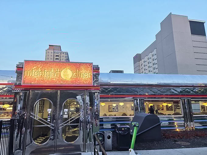 That gleaming silver diner car looks like it rolled straight out of a 1950s movie set.