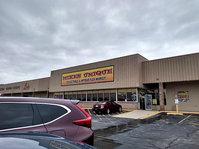 Mike's Unique exterior beckons with its bold yellow sign. A treasure hunter's paradise waiting behind those unassuming doors.