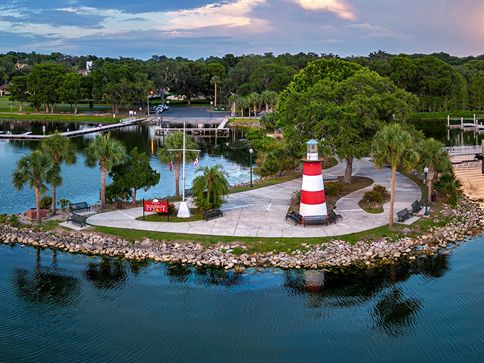 Mount Dora's lighthouse stands like a cheerful sentinel, guarding the peaceful waters where memories are made by the boatload.