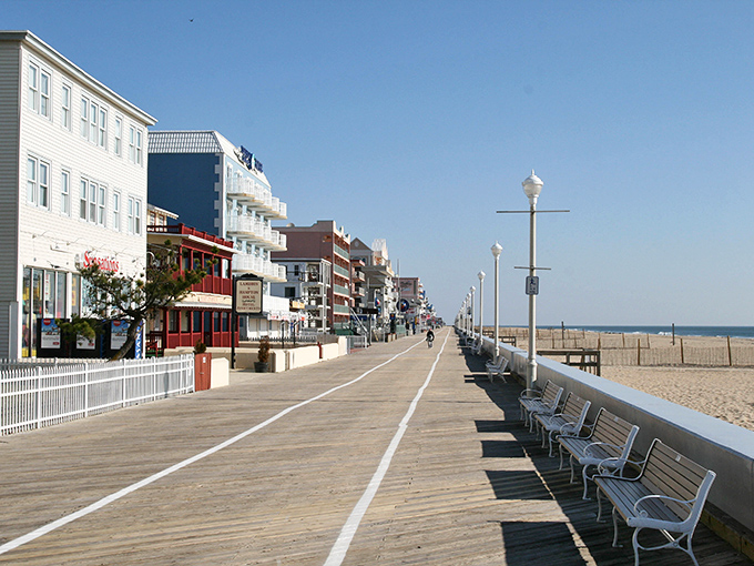 Ocean City's iconic boardwalk stretches into the horizon, where wooden benches invite you to sit and watch the Atlantic dance with the shore.
