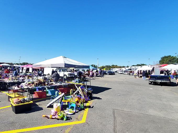 Treasure hunting under blue skies! Colorful tents and tables stretch across Patapsco's parking lot, promising discoveries at every turn.
