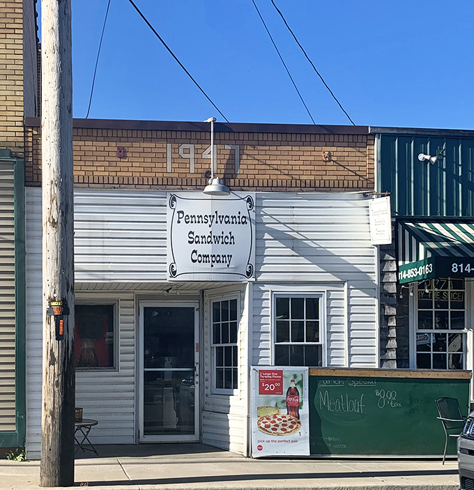 Sometimes the best treasures hide behind the simplest storefronts - this white building holds sandwich magic.