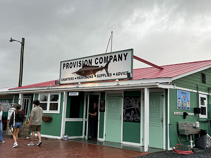 That green building isn't just charming - it's your gateway to seafood heaven by the water.