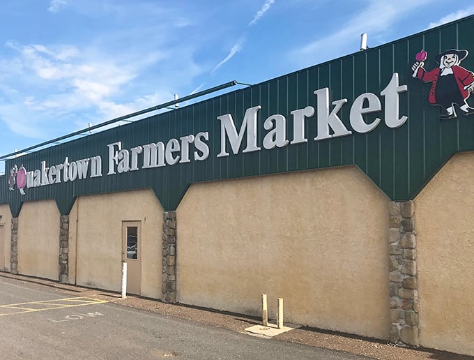 The Quakertown Farmers Market entrance beckons like a retail Narnia – where every door leads to treasures you didn't know you needed.