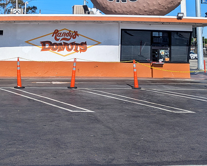 Sometimes the most iconic spots hide behind the simplest facades - orange cones marking sweet territory ahead.