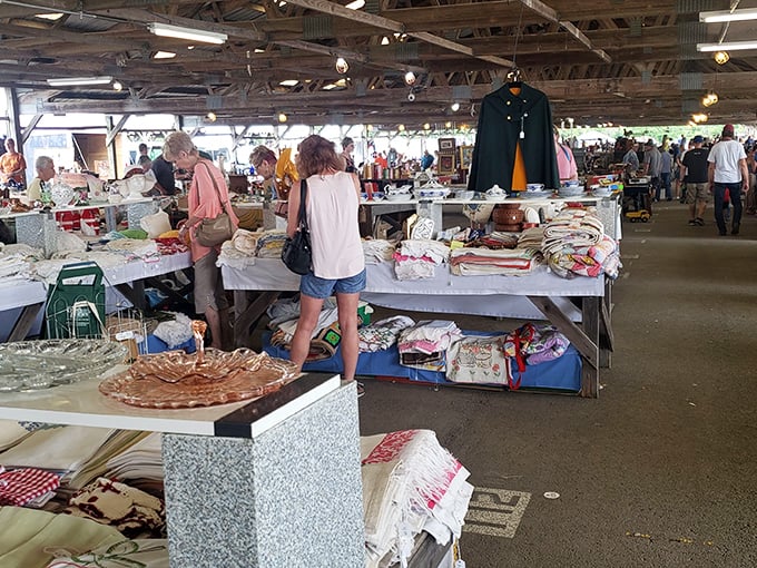 Tables overflow with treasures waiting to be discovered by eager shoppers browsing endless possibilities.