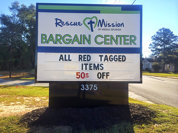 The Rescue Mission Bargain Center sign promises 50% off red-tagged treasures &ndash; like a scavenger hunt where everyone wins!