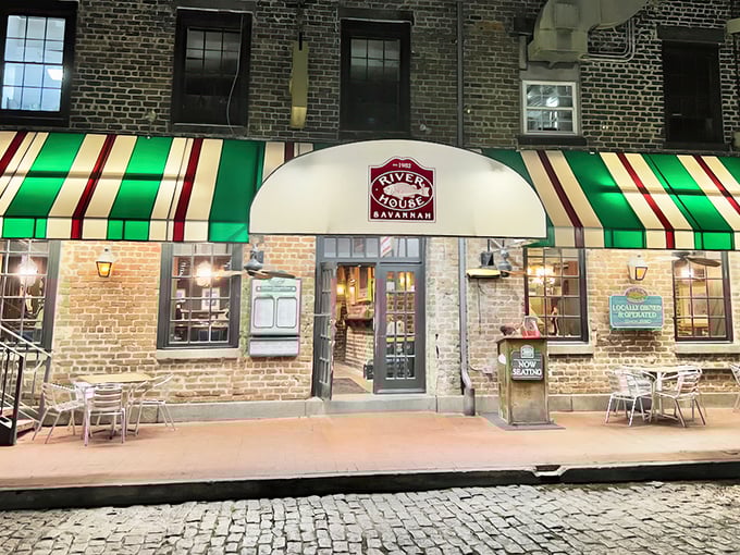 That green and white striped awning beckons like a lighthouse for hungry seafood lovers in historic Savannah.