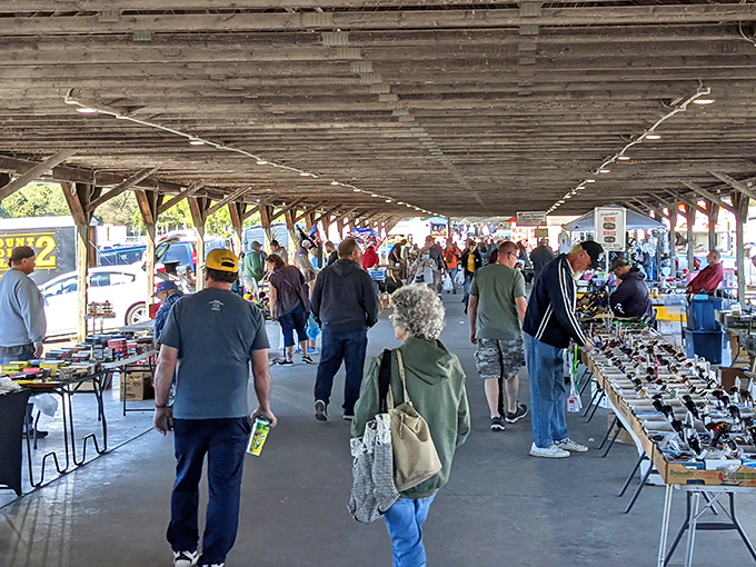 Treasure hunters navigate the covered walkways of Rogers Community Auction, where bargain magic happens under one massive roof.