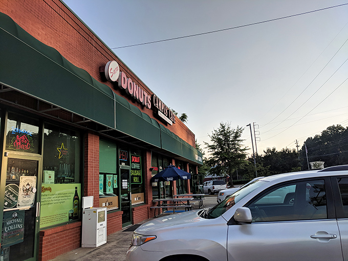 That green awning beckons like a lighthouse for donut lovers navigating suburban hunger pangs.