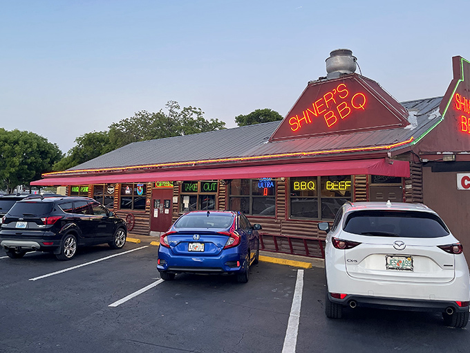 That neon glow isn't just a sign&mdash;it's a beacon of barbecue hope calling hungry travelers from miles around.