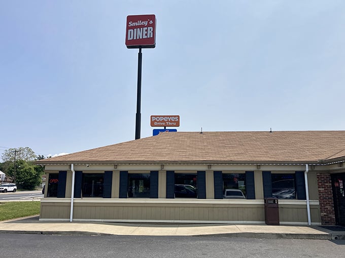 Classic red and white diner sign that beckons like a roadside beacon of comfort food dreams.