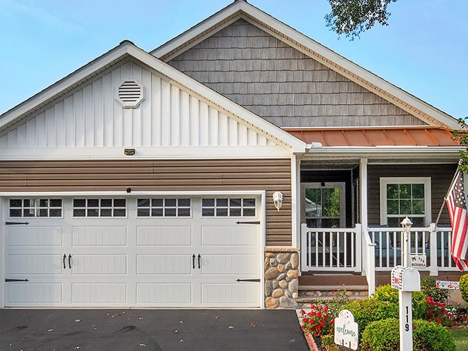 A charming cottage-style home at Southern Meadow with a welcoming front porch that practically begs for morning coffee conversations.