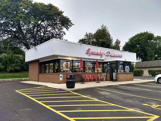 Spunky Dunkers' classic storefront promises sweet treasures inside. That red sign has been guiding donut lovers to happiness for years!