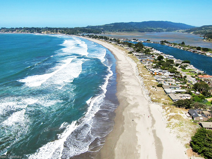 Stinson Beach's golden coastline stretches like nature's own welcome mat between rolling hills and endless blue.