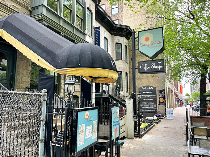 Sunny Side Up's basement entrance beckons like a secret breakfast club. That black awning might as well say "Pancake Paradise Below."
