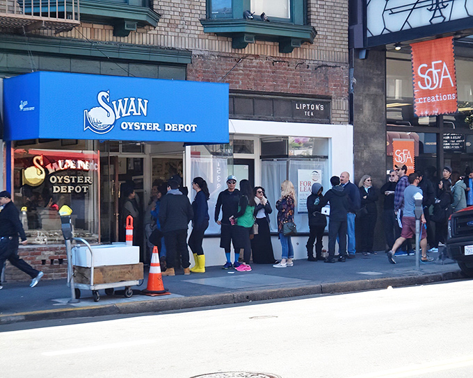 That blue awning beckons like a seafood siren - Swan Oyster Depot's legendary counter awaits your arrival.