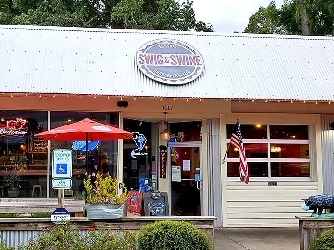Swig & Swine's rustic charm beckons from the roadside, promising smoky treasures under that metal roof.