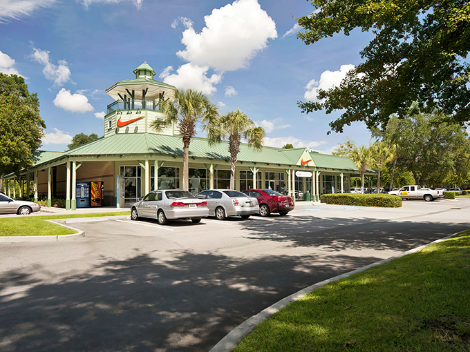 The iconic green-roofed Nike store at Tanger Outlets Hilton Head stands like a retail lighthouse, beckoning bargain hunters to safe shopping harbors.