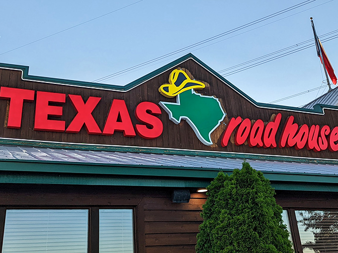 That Texas Roadhouse sign glows like a beacon calling hungry folks home for perfectly grilled beef and warm rolls.