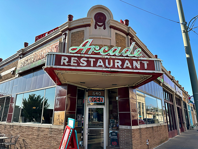 The iconic corner marquee of The Arcade Restaurant glows with vintage charm &ndash; Memphis history served with a side of neon nostalgia.