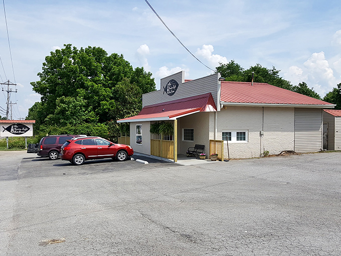 The Beacon Light Tea Room: A humble roadside gem where crispy chicken dreams come true. That red roof promises comfort food that'll make your soul sing.