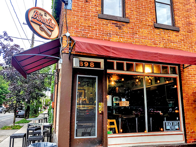 That classic brick facade whispers promises of sandwich perfection waiting just beyond those welcoming glass doors.