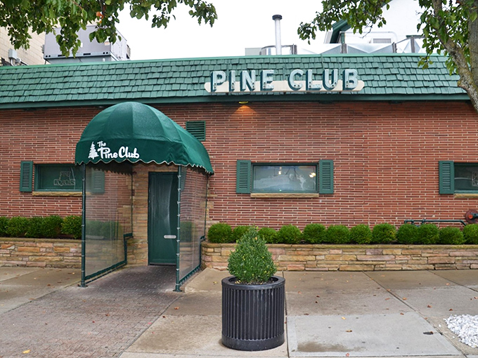 The Pine Club: Where that classic red sign promises a time machine to the golden age of steakhouses. No frills, just thrills for your taste buds.
