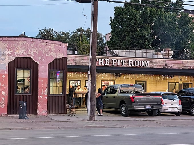 The Pit Room's faded pink exterior might not scream "BBQ royalty," but that line of hungry Houstonians tells the real story.