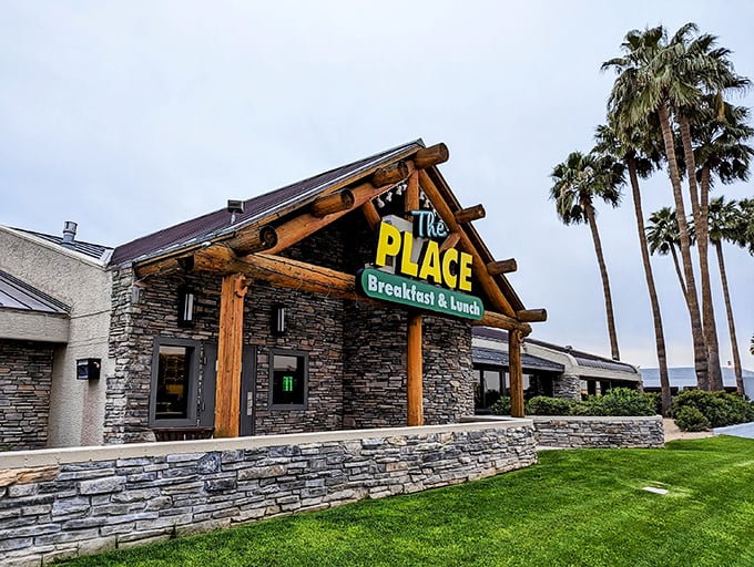 Stone walls and timber beams create a rustic lodge atmosphere that whispers "comfort food ahead."