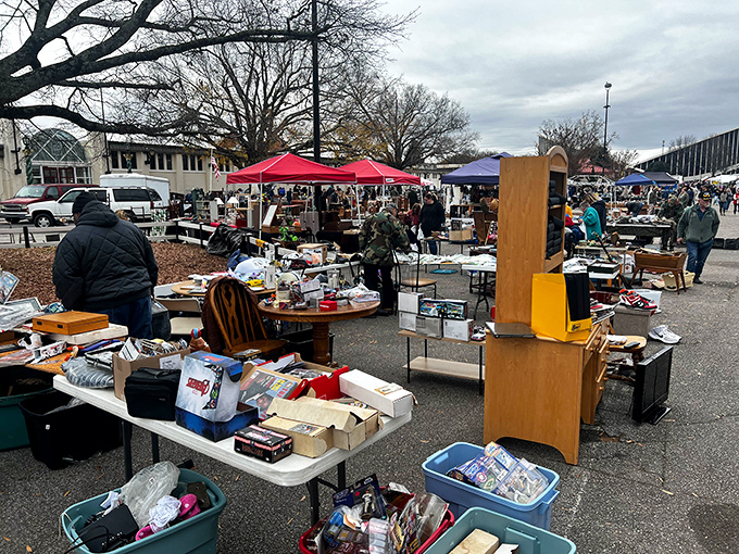 Treasure hunters gather under cloudy skies at The Raleigh Flea Market, where every table holds potential gold.