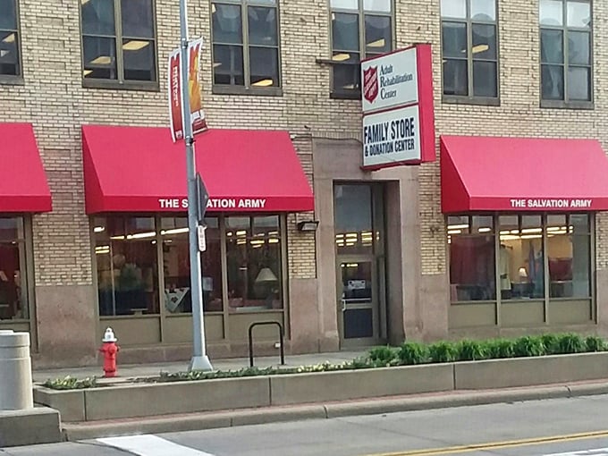 The Salvation Army's bright red awnings beckon like a lighthouse for bargain hunters. Inside, treasures await discovery!