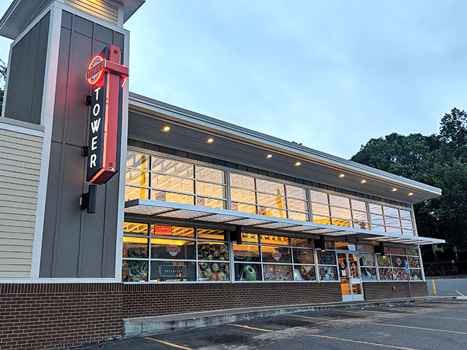 That neon "TOWER" sign glows like a beacon for sandwich seekers in East Nashville's culinary landscape.