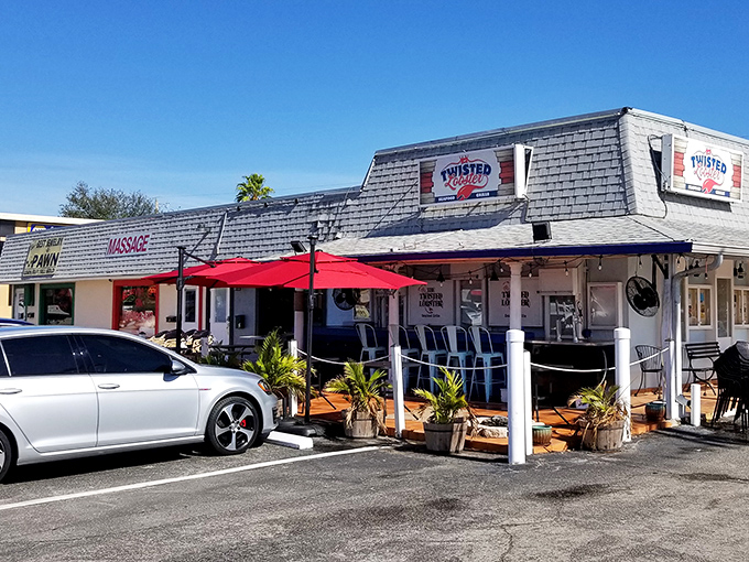 That red awning beckons like a lighthouse for seafood lovers seeking their next great catch.