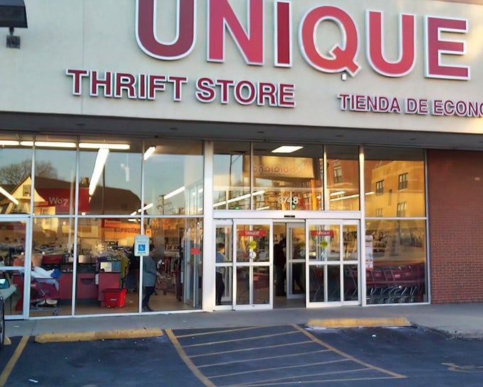 The bright red Unique Thrift Store sign promises treasure hunting adventures inside this Chicago bargain paradise.