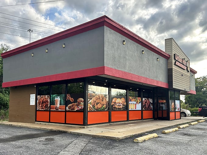 Urban Hot Chicken's storefront promises spicy delights! The bright orange windows showcase a menu that'll make your taste buds stand at attention.