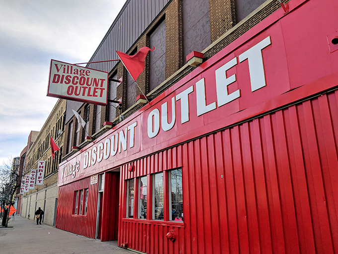 The unmistakable red facade of Village Discount Outlet stands out like a bargain-hunter's North Star on Milwaukee Avenue.