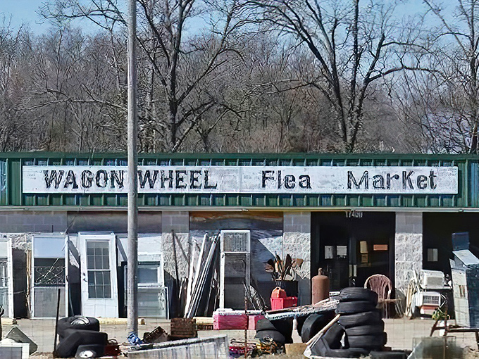 The Wagon Wheel Flea Market sign promises treasures behind those doors. Like a time machine disguised as a shopping trip!